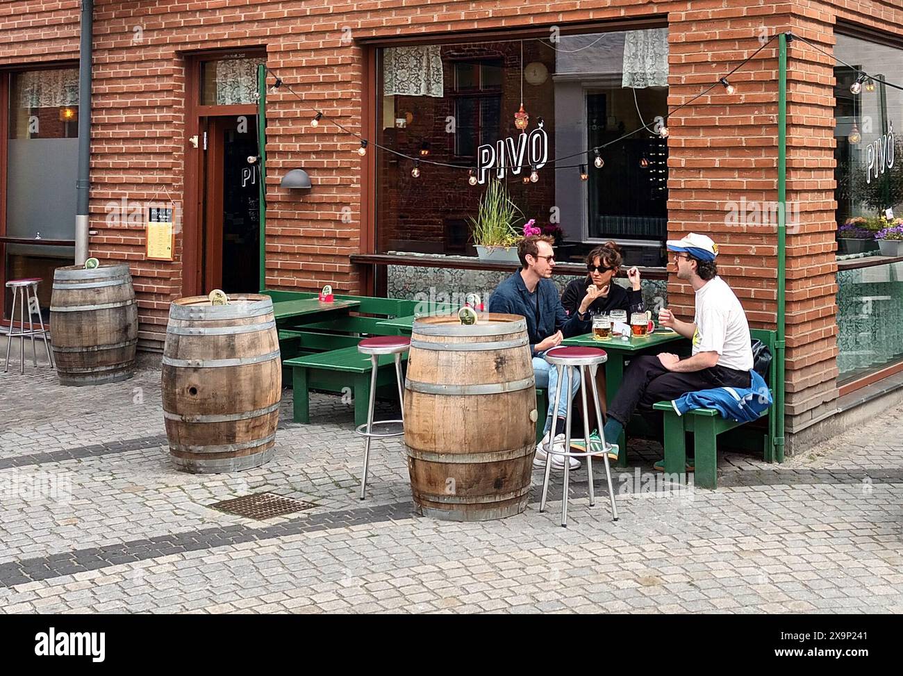 Malmo, Sweden. 29th May, 2024. Guests sit in the front garden of one of ...