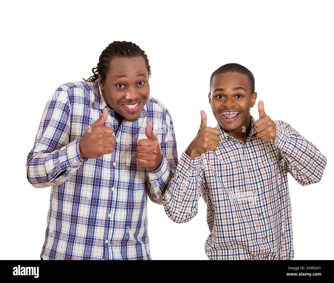 Closeup portrait handsome happy, young men showing two thumbs up sign ...