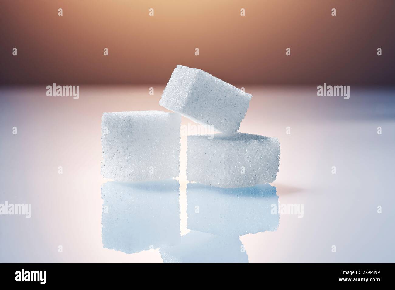Three pieces of sugar with reflection Stock Photo - Alamy