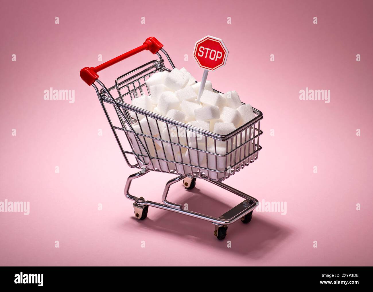 A lot of sugar in the shopping cart with a stop sign Stock Photo - Alamy