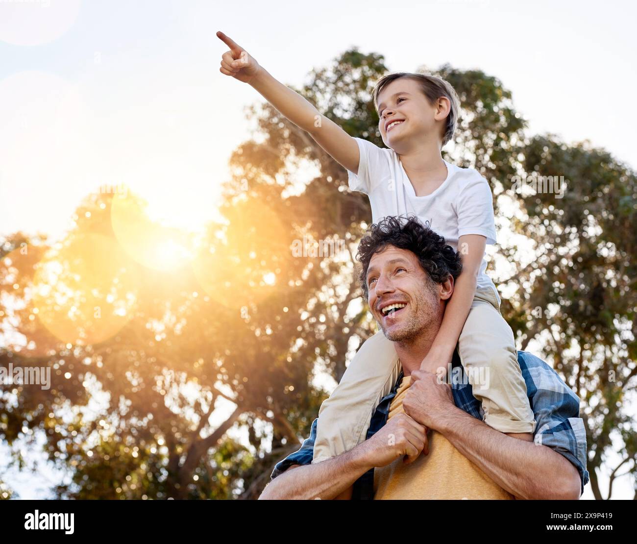 Happy, father and boy on shoulder pointing outdoor together for future ...