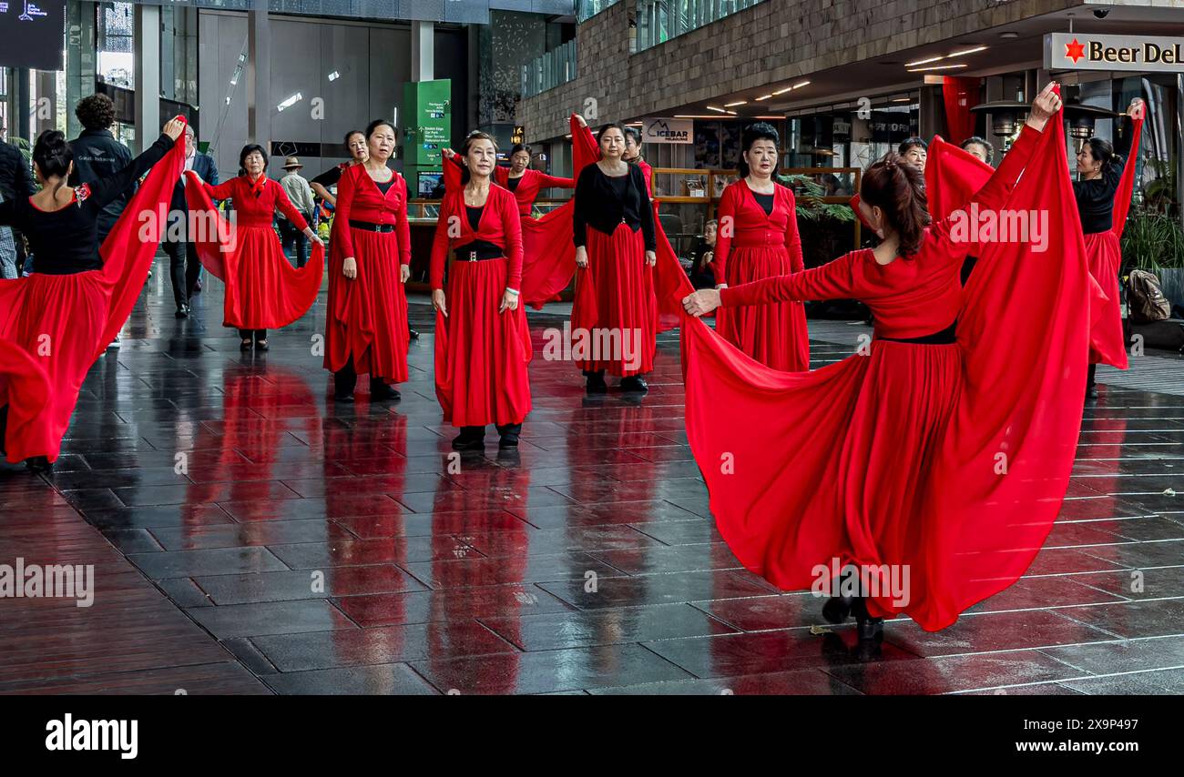 Group dancers in red dresses hi-res stock photography and images - Alamy