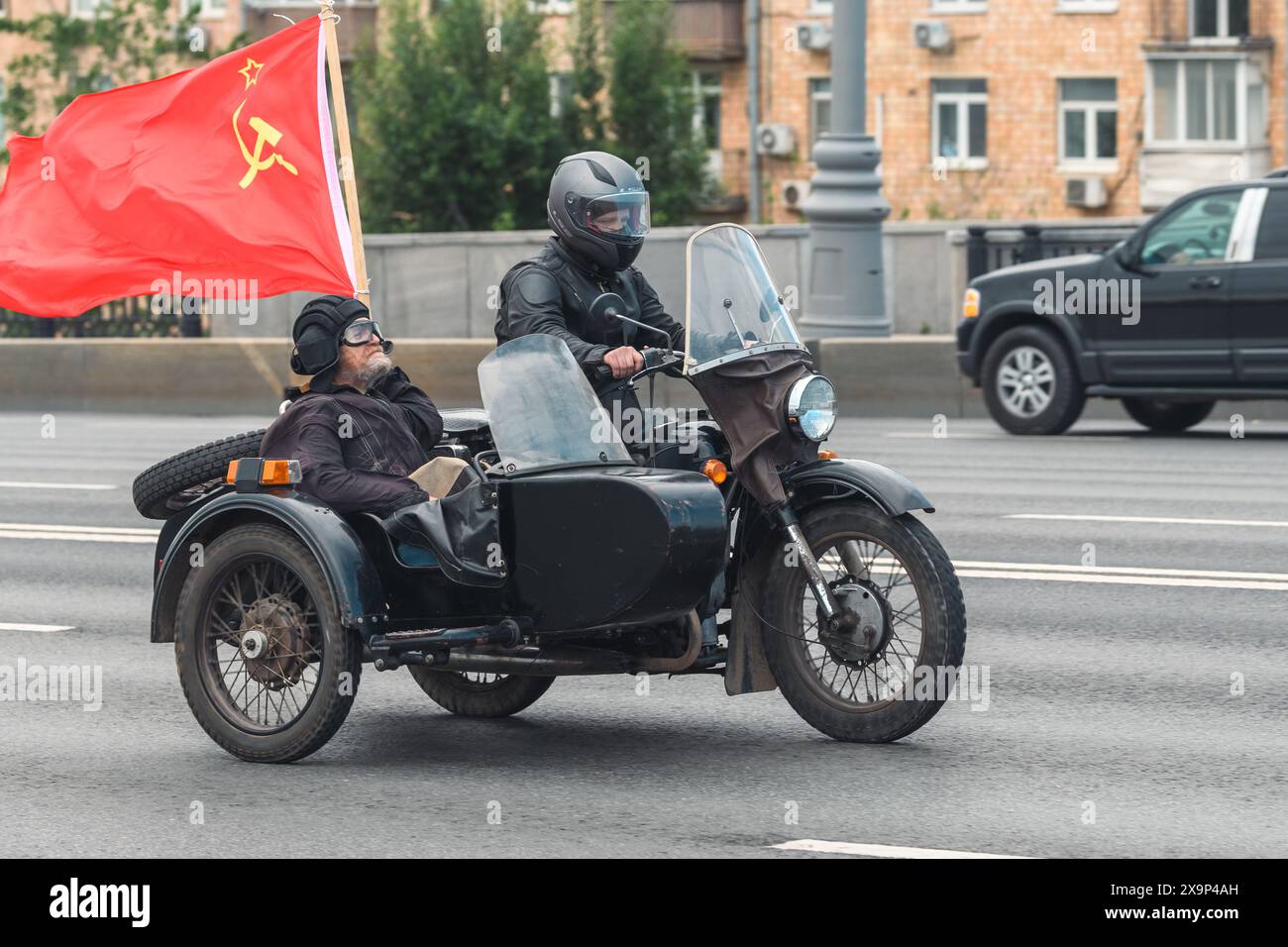 Moscow, Russia - May 26, 2024: A motorcyclist with a sidecar adorned ...