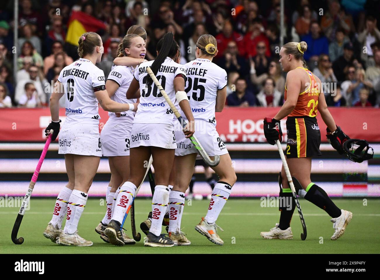 Belgium's players celebrate after scoring during a hockey game between ...