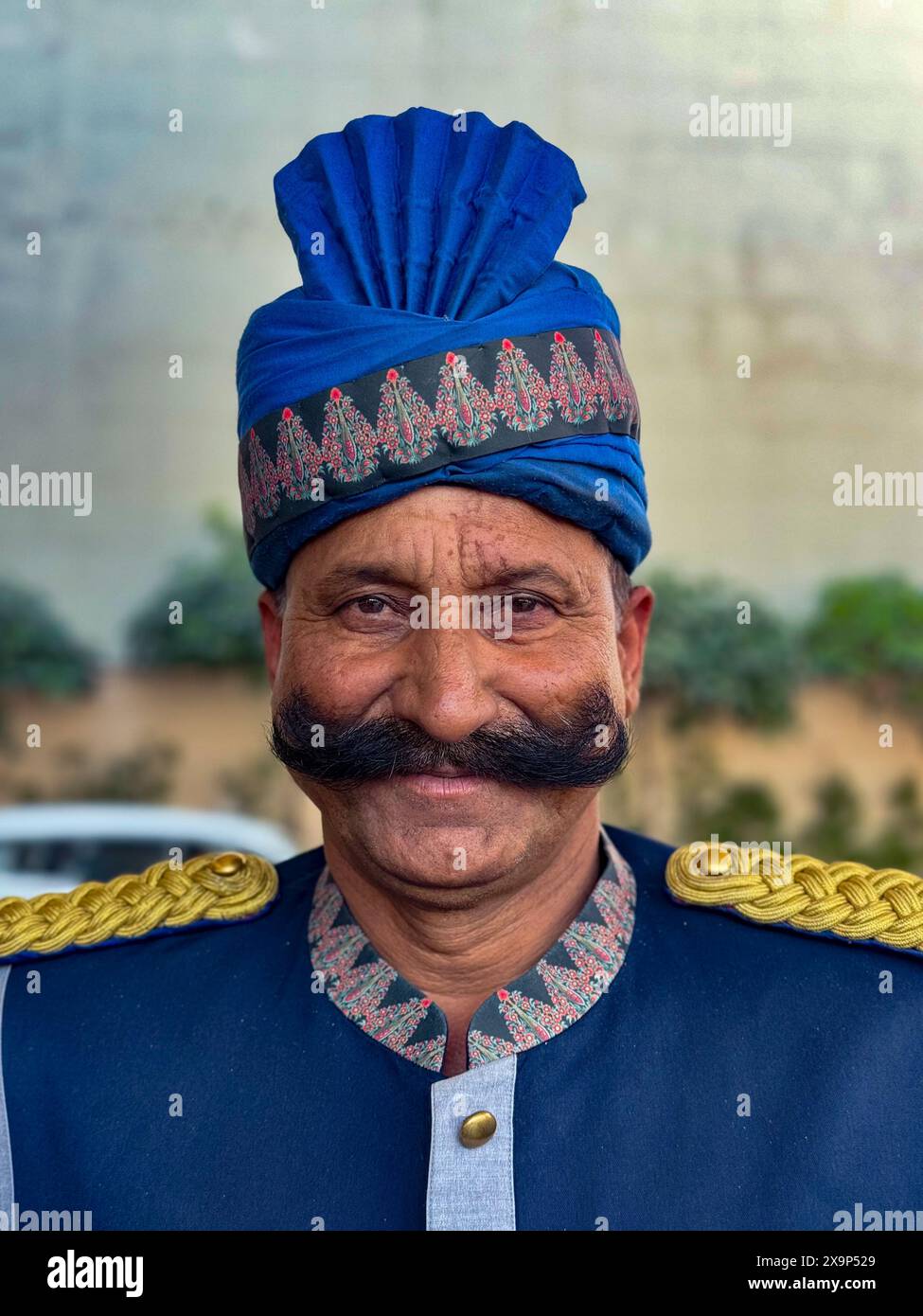 Closeup of an indian guard wearing a decorated turban and ceremonial ...