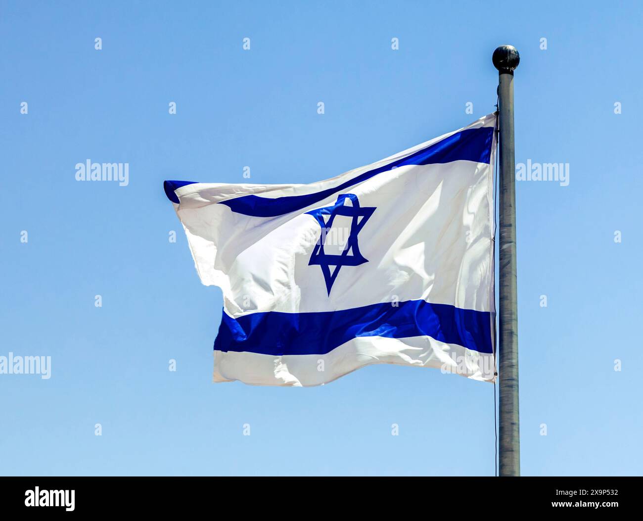 The Israeli flag waving in the bright sunlight Stock Photo - Alamy