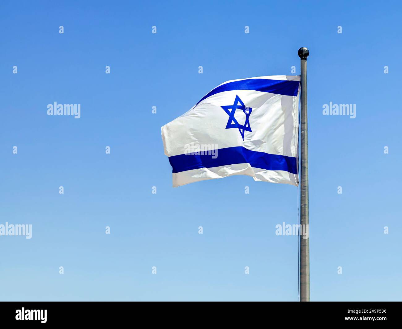 The Israeli flag waving in the bright sunlight Stock Photo - Alamy