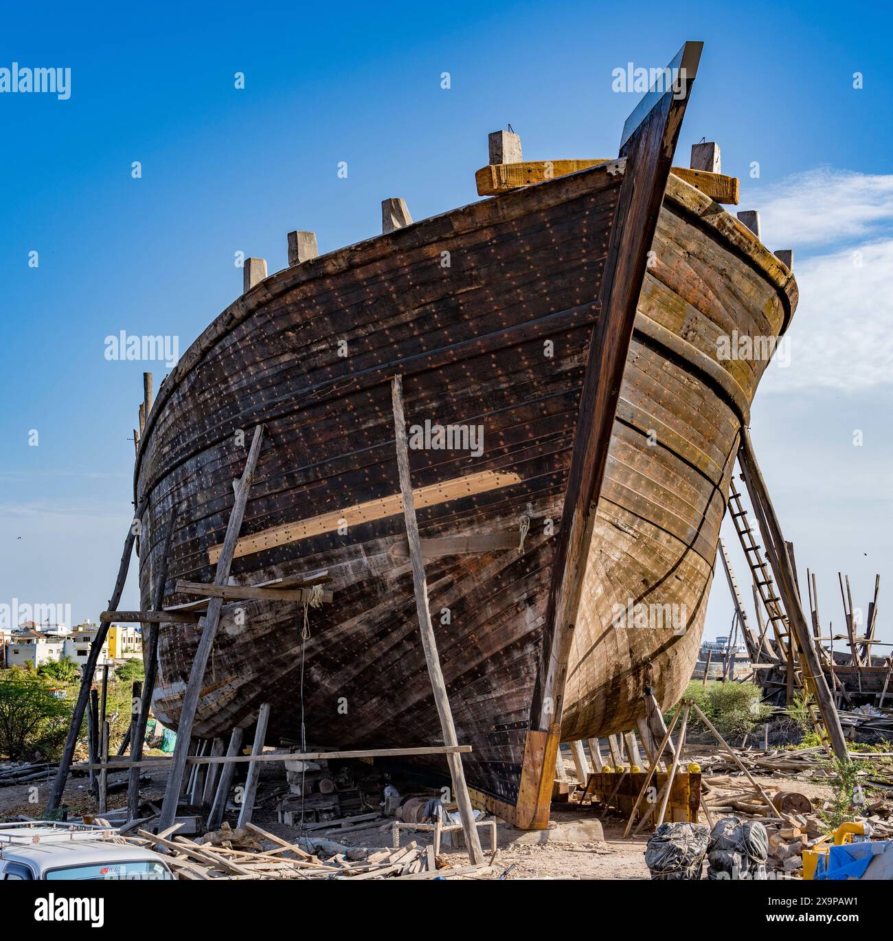 Impressive wooden ship being built, showcased in a shipyard against a ...