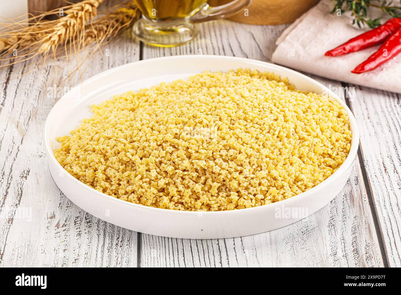 Italian cuisine - dry stelline pasta for bowl Stock Photo - Alamy