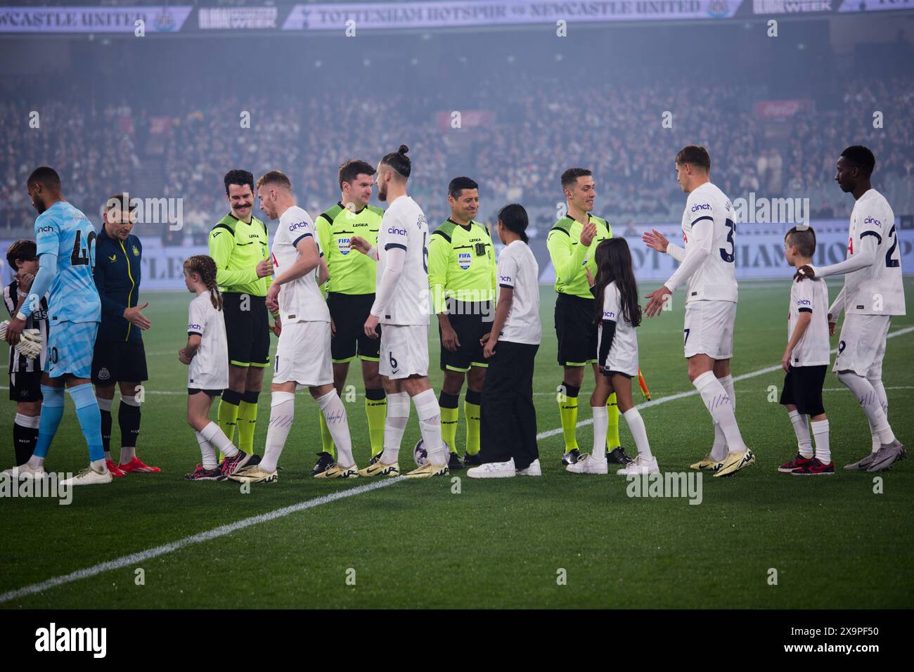 Match referees and players shake hands before the Exhibition match ...