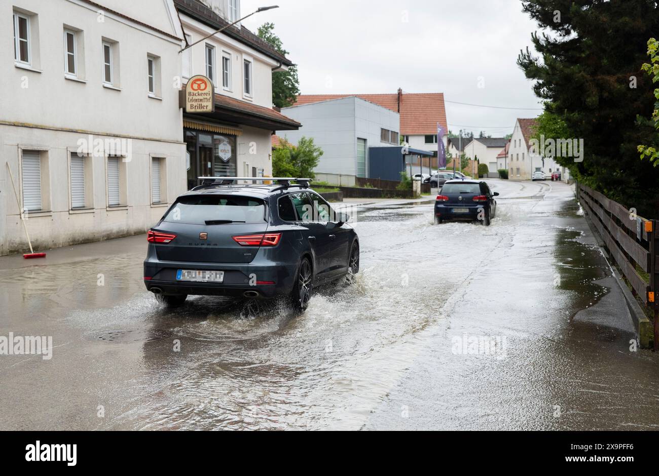 Frankfurt, Germany. 02nd June, 2024. Vehicles wade through a flooded ...