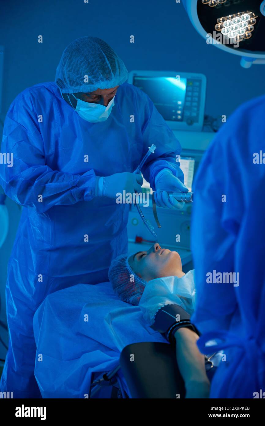 Anesthesiologist gives woman patient anesthesia treatment for general ...