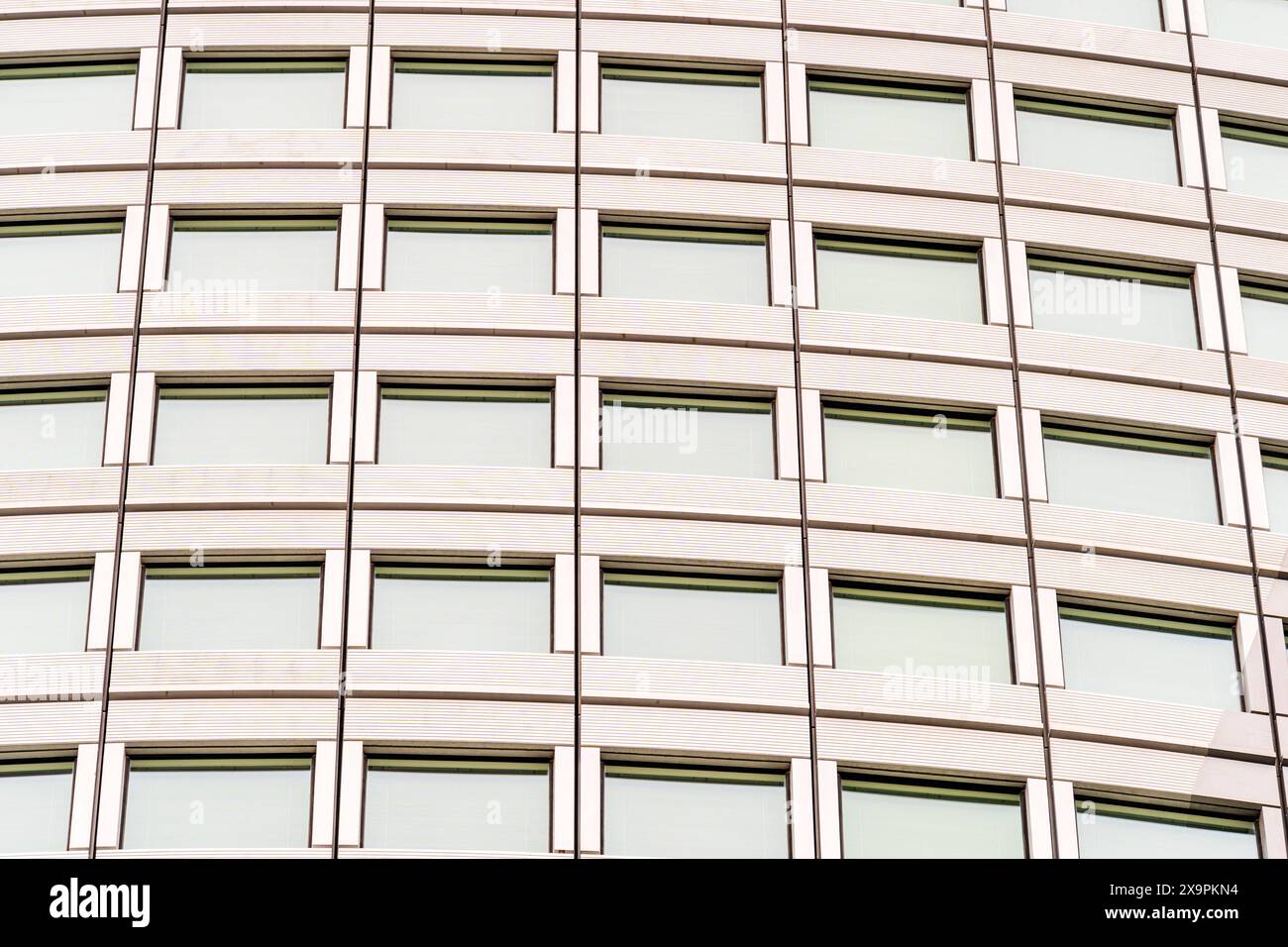 Close up of windows on a high rise office block. Each window is ...