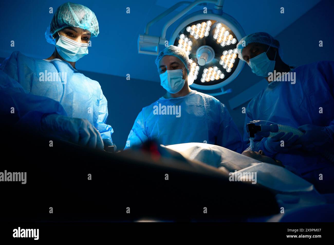Surgeon performing operation in modern operating room Stock Photo - Alamy