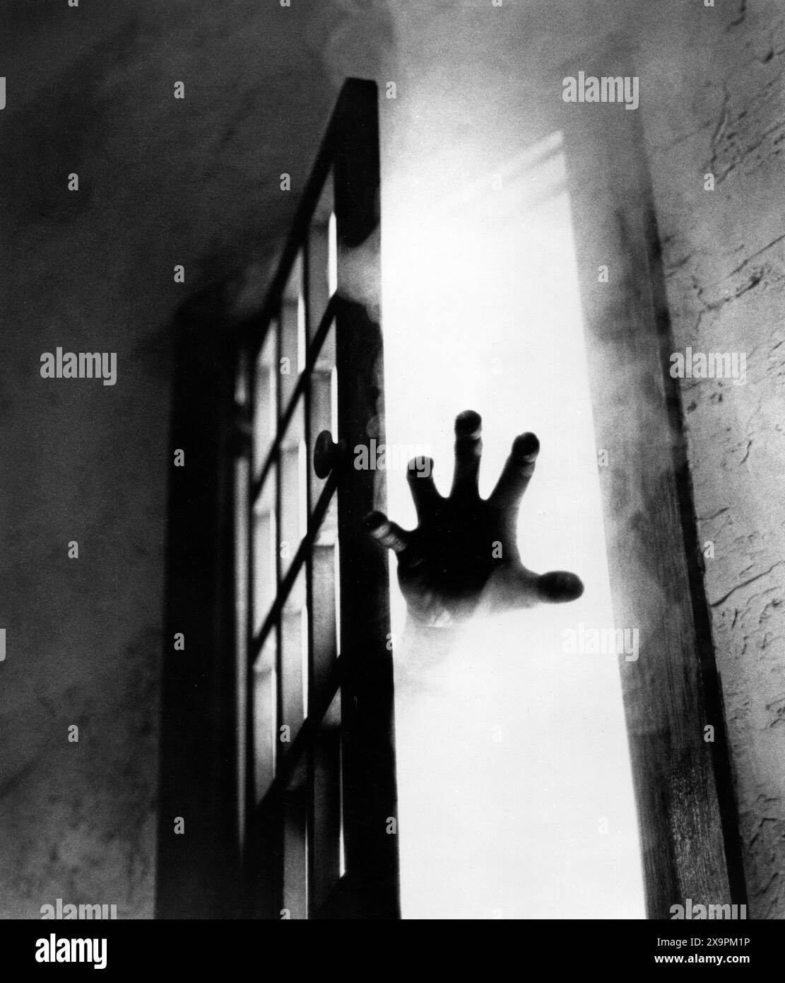 Hand emerging from mysterious mist, on-set of the film, "The Fog", AVCO ...