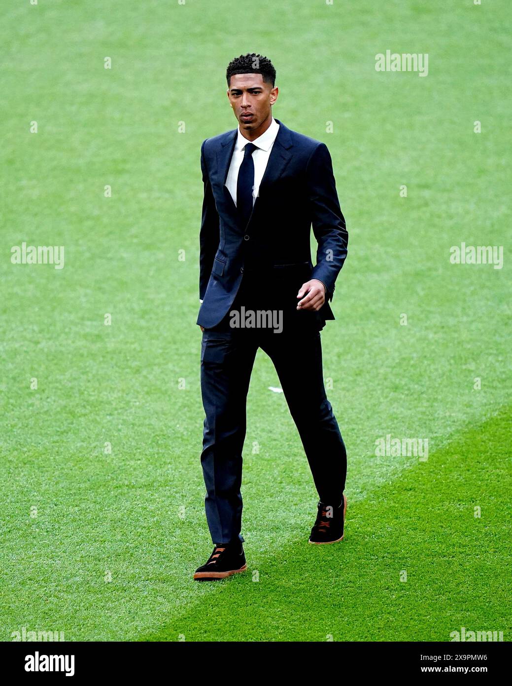 Real Madrid's Jude Bellingham inspects the pitch ahead of the UEFA ...