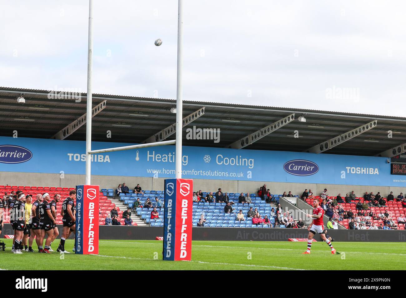 Marc Sneyd of Salford Red Devils takes the conversion kick and scores ...