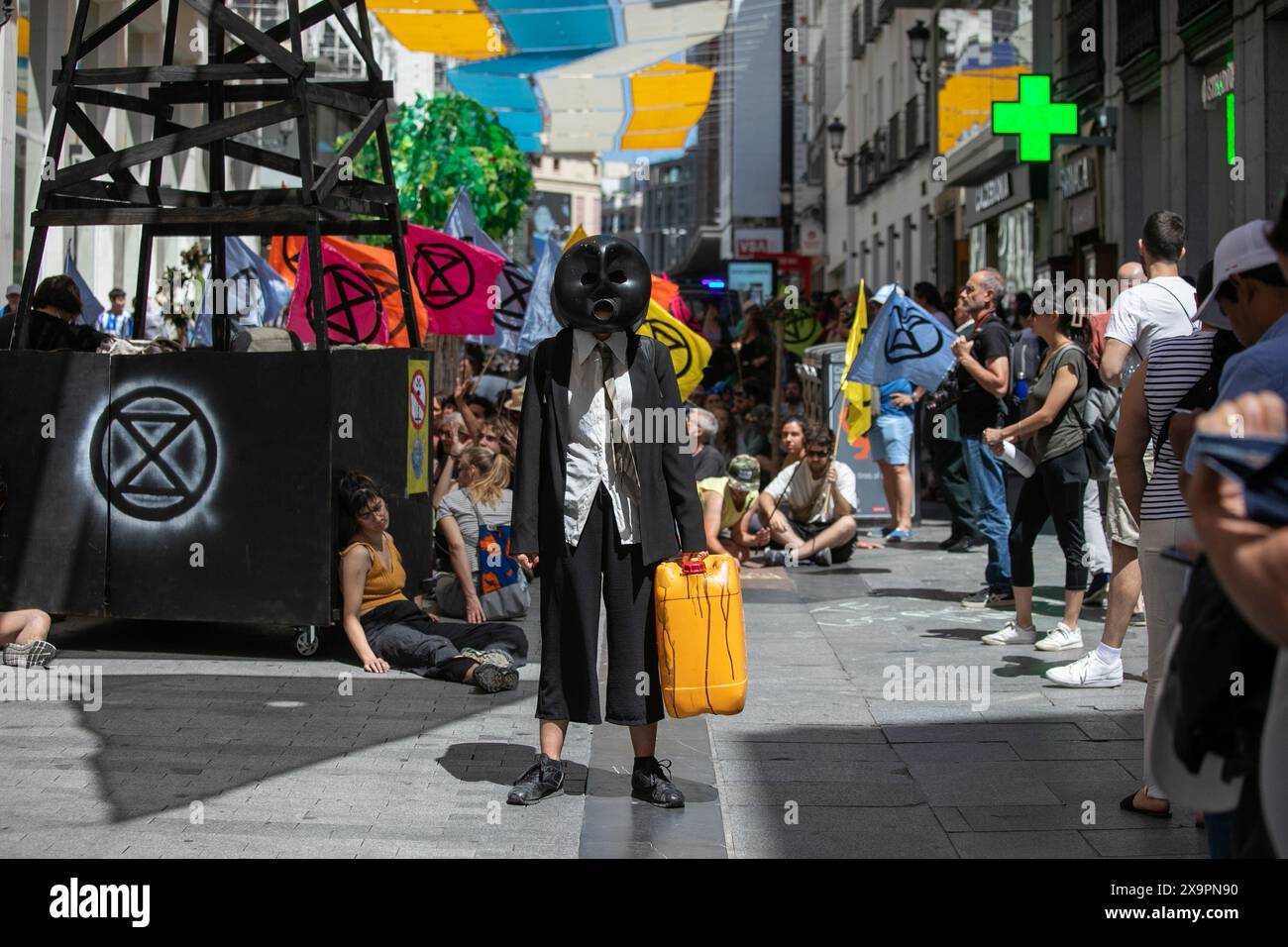 Madrid, Spain. 02nd June, 2024. An activist wears a mask with a ...