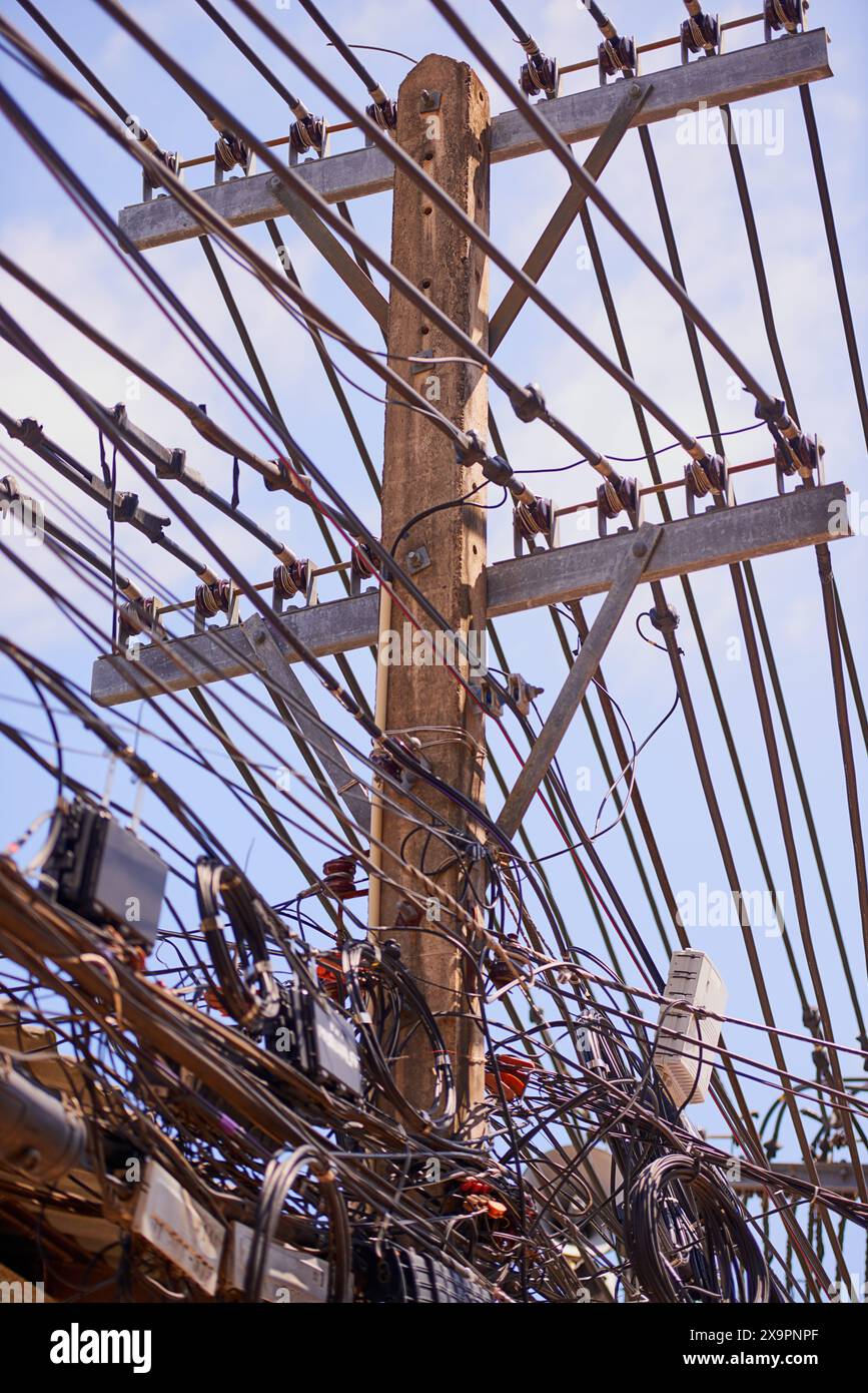 Telephone, connection and cables on pole with blue sky for electricity ...