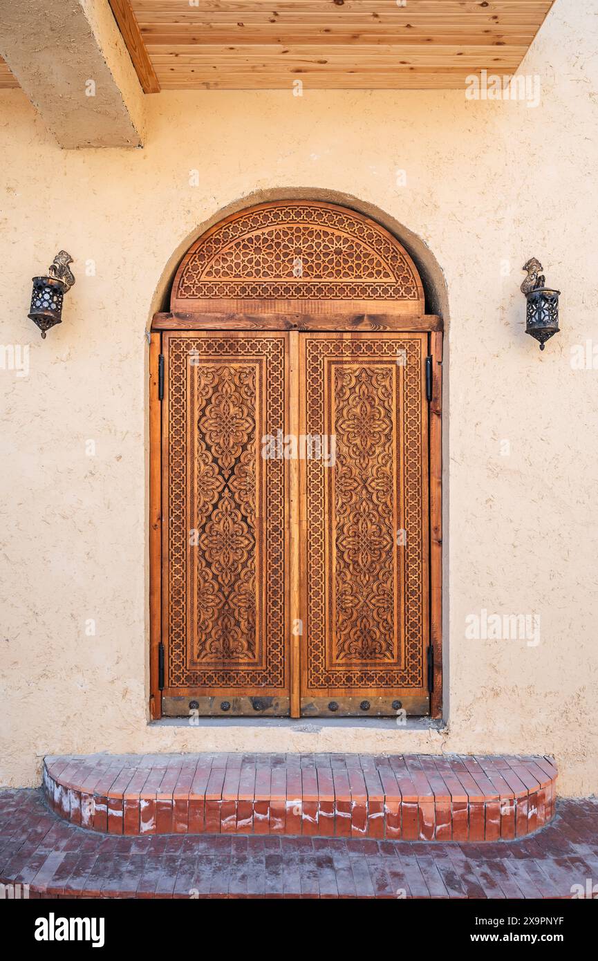 carved wooden door with a uzbek pattern decorated with oriental arabic ...