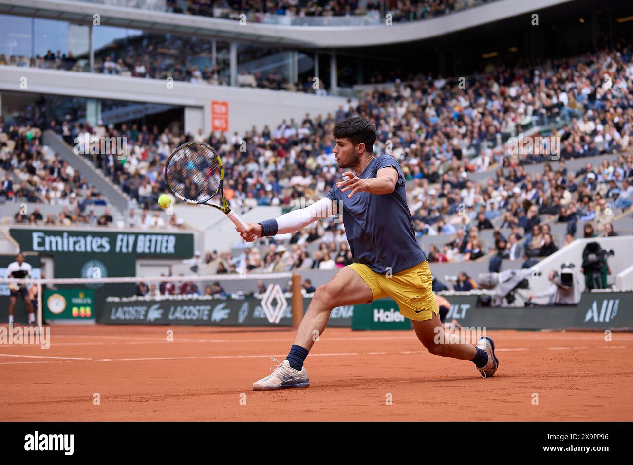Paris, France. 02nd June, 2024. Carlos Alcaraz of Spain returns a ball against Felix Auger ...