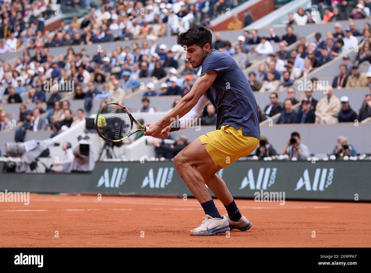 Paris, France. 02nd June, 2024. Carlos Alcaraz of Spain returns a ball against Felix Auger ...