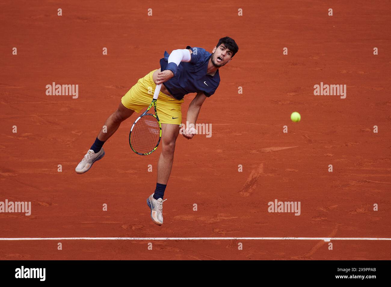 Paris, France. 02nd June, 2024. Carlos Alcaraz of Spain serves against Felix Auger-Aliassime of ...