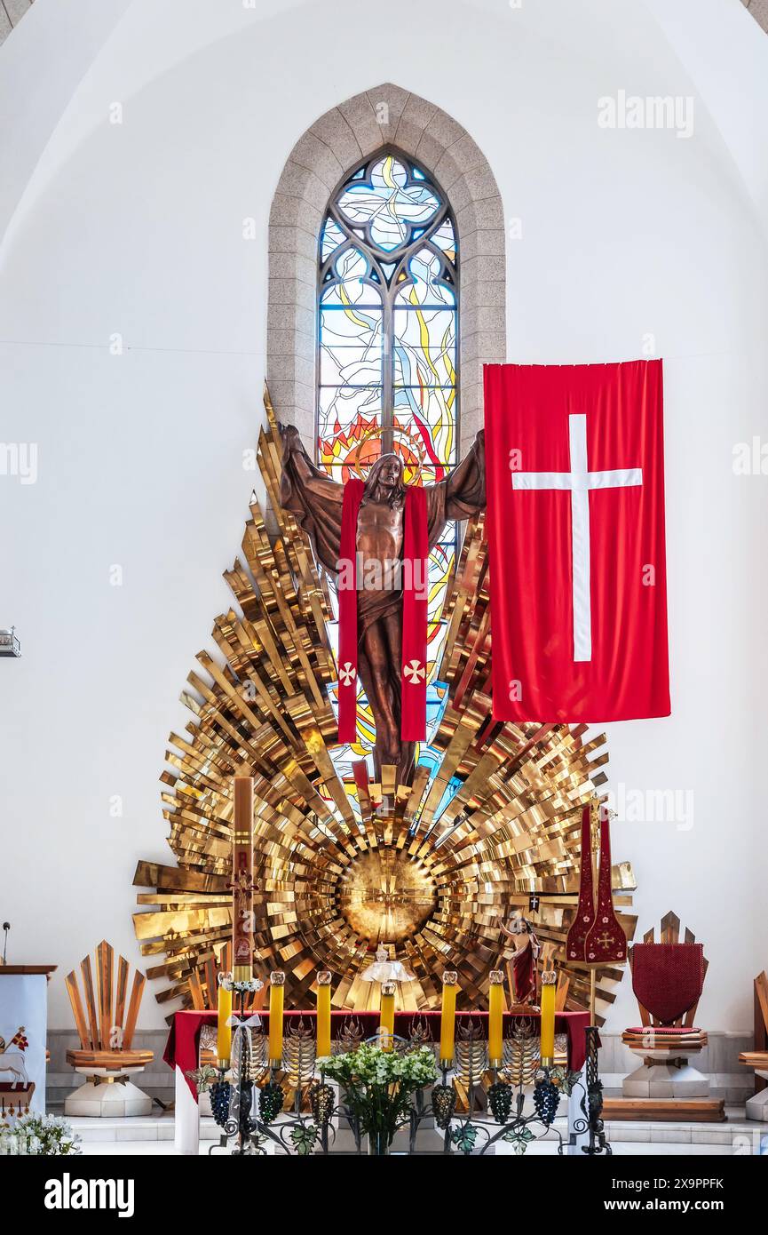 altar with Jesus Christ and a cross in the interior of a white ...