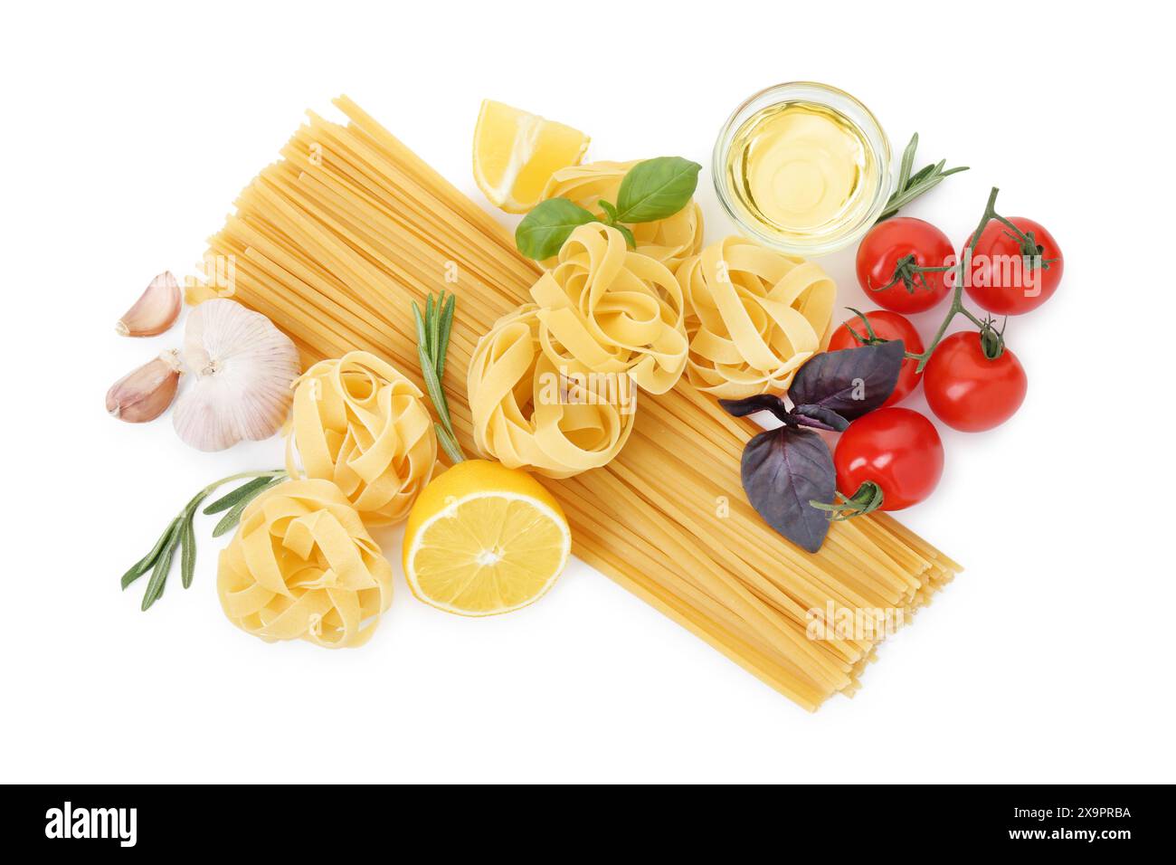 Different types of pasta and ingredients on white background, top view ...