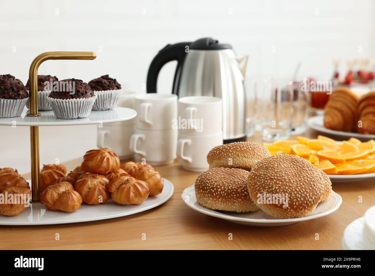 Different meals served on wooden table indoors, closeup. Buffet menu ...