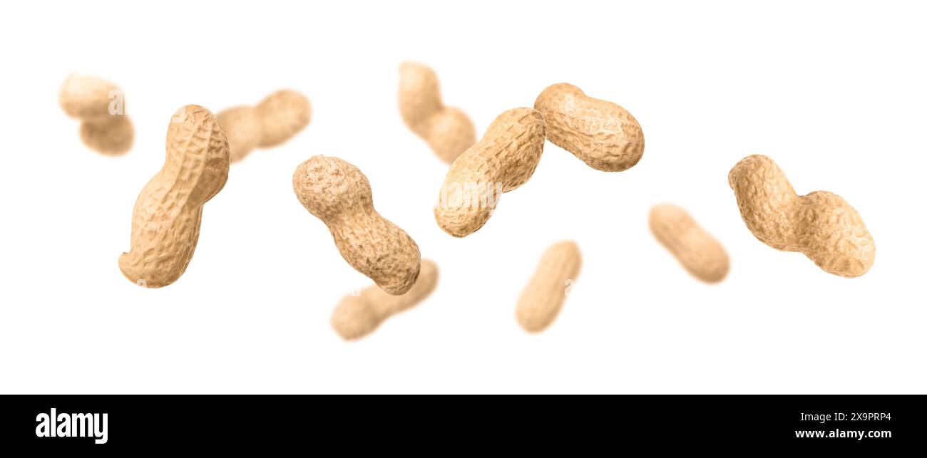 Unpeeled peanuts in air on white background Stock Photo - Alamy