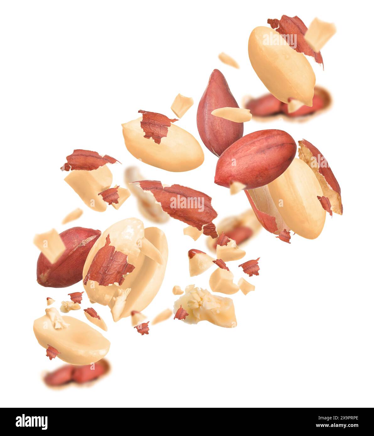 Unpeeled peanuts in air on white background Stock Photo - Alamy