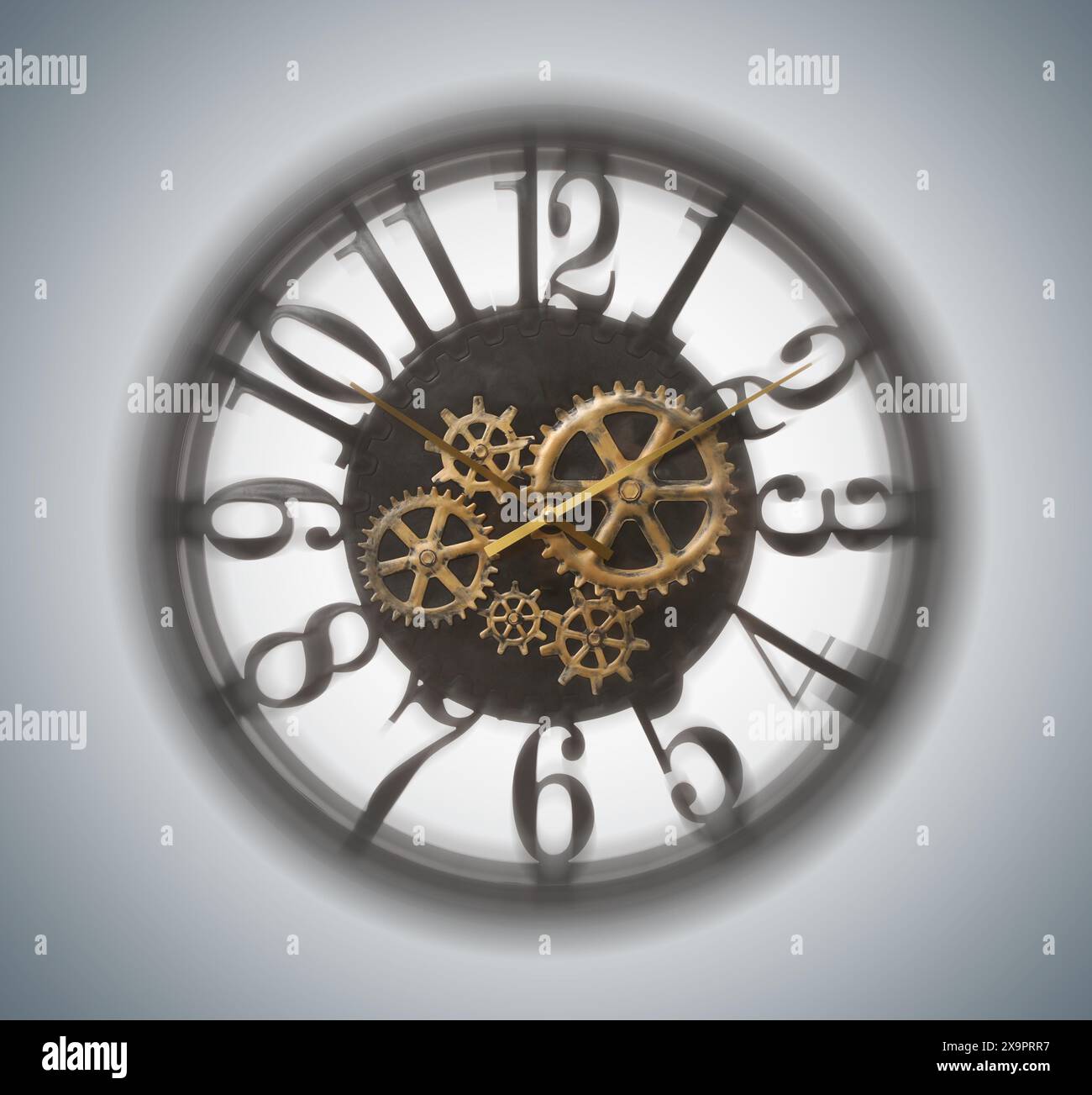 Clock with cogwheels, motion blur effect. Time concept Stock Photo - Alamy
