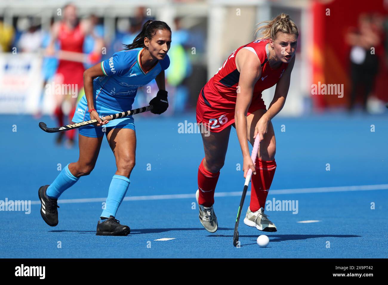 Great Britain's Lily Owsley (right) battles for the ball against India's Sharmila Devi during ...