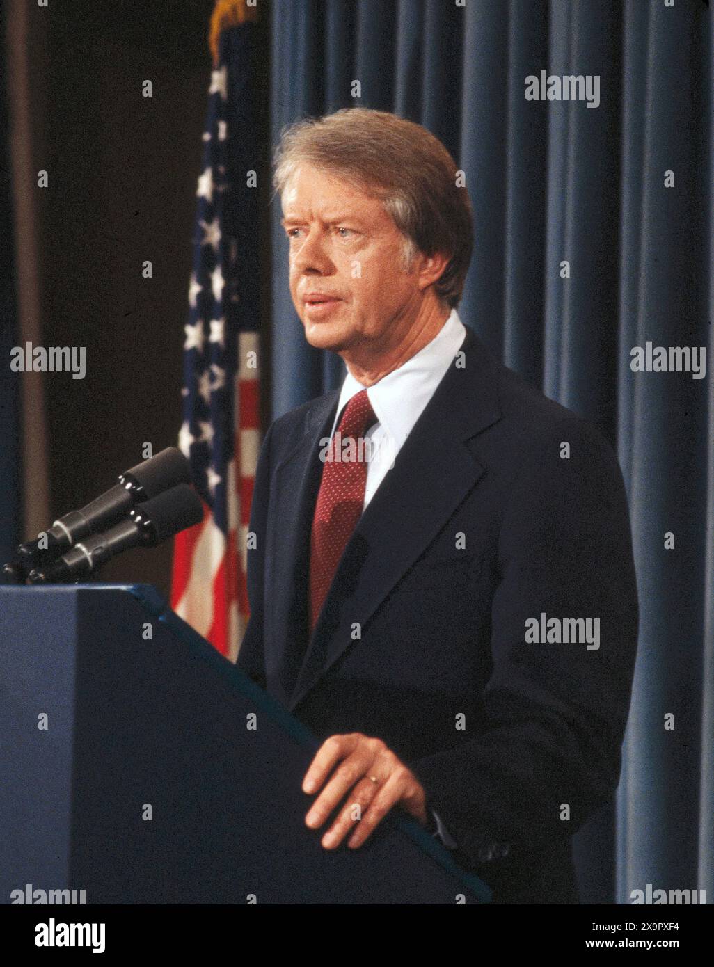 U.S. President Jimmy Carter at podium during news conference, half ...