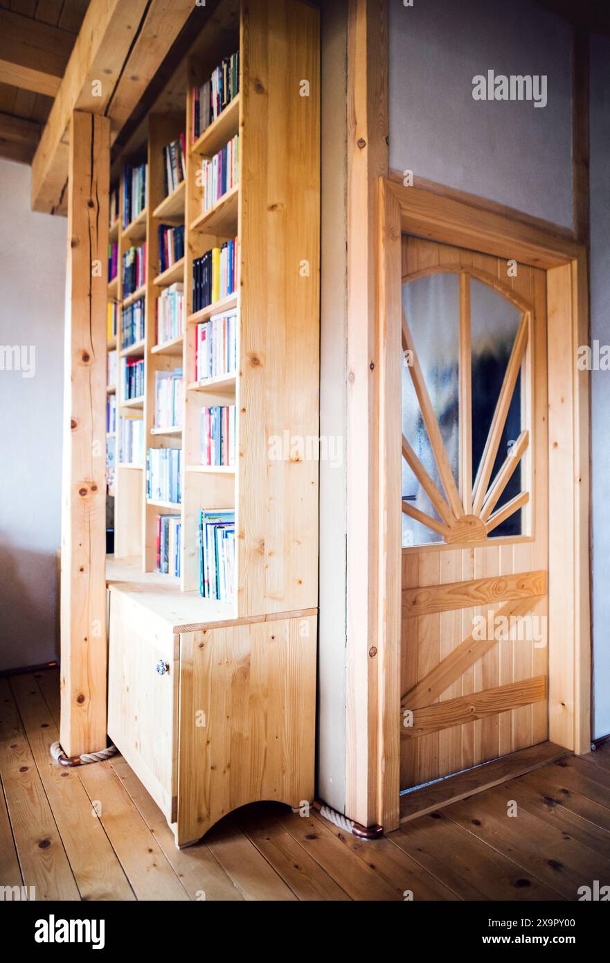 Wooden bookcase in living room in vintage rustic style, wooden ...