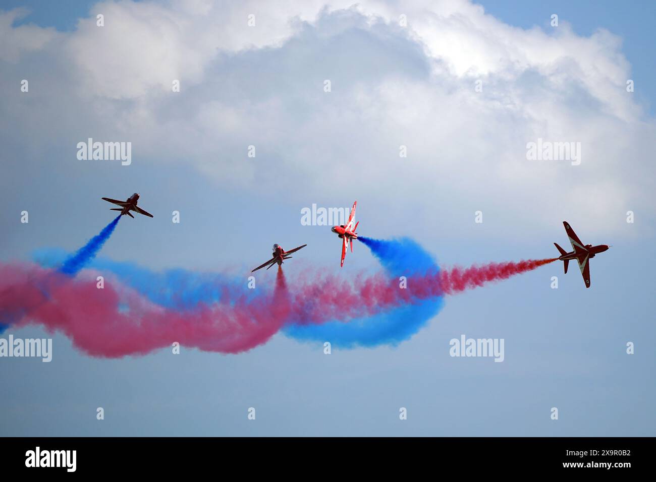 The RAF Red Arrows display team perform during the IWM Duxford Air Show ...