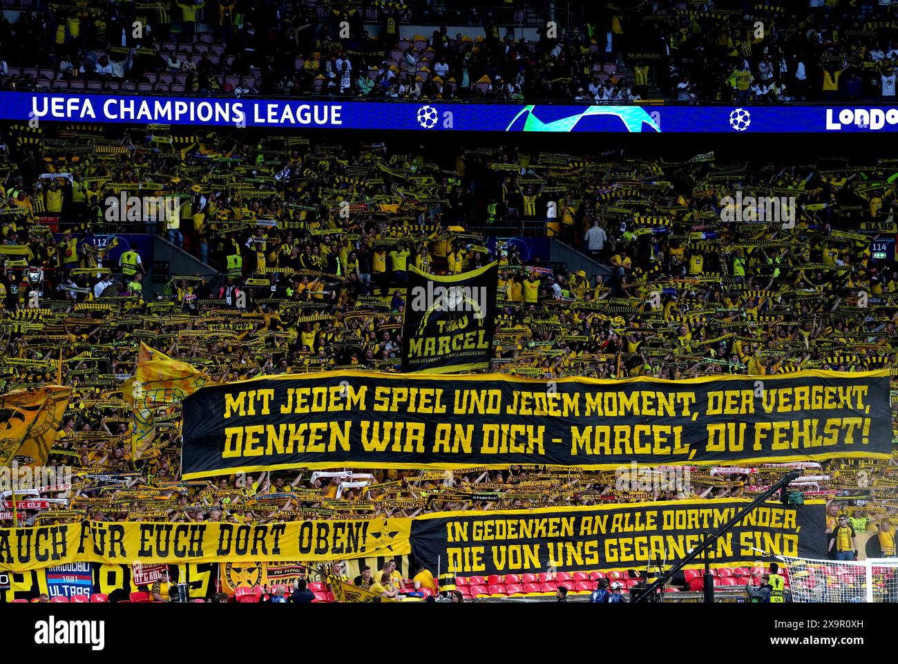 Borussia Dortmund fans hold up banners in the stands ahead of the UEFA ...