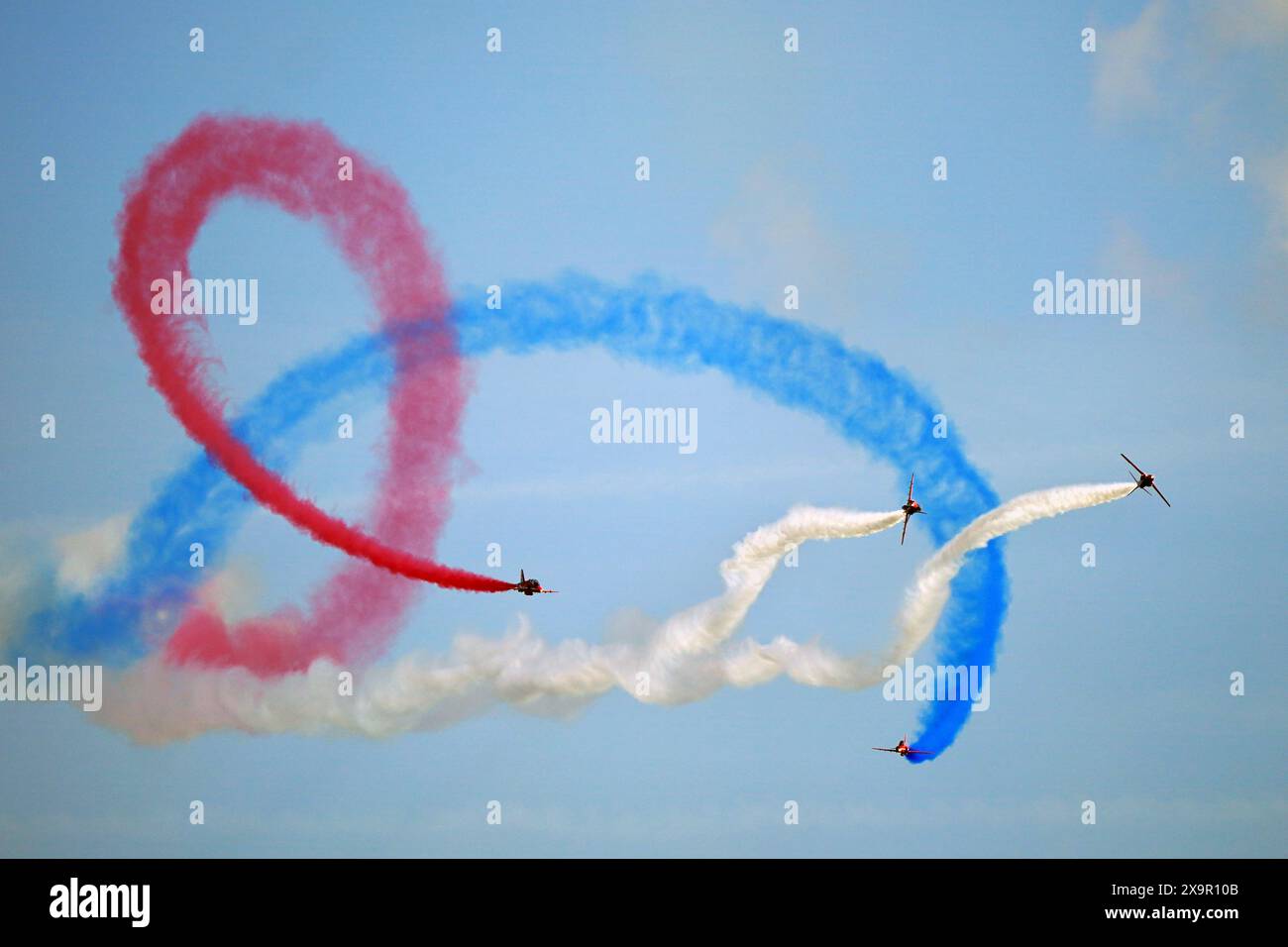 The RAF Red Arrows display team perform during the IWM Duxford Air Show ...
