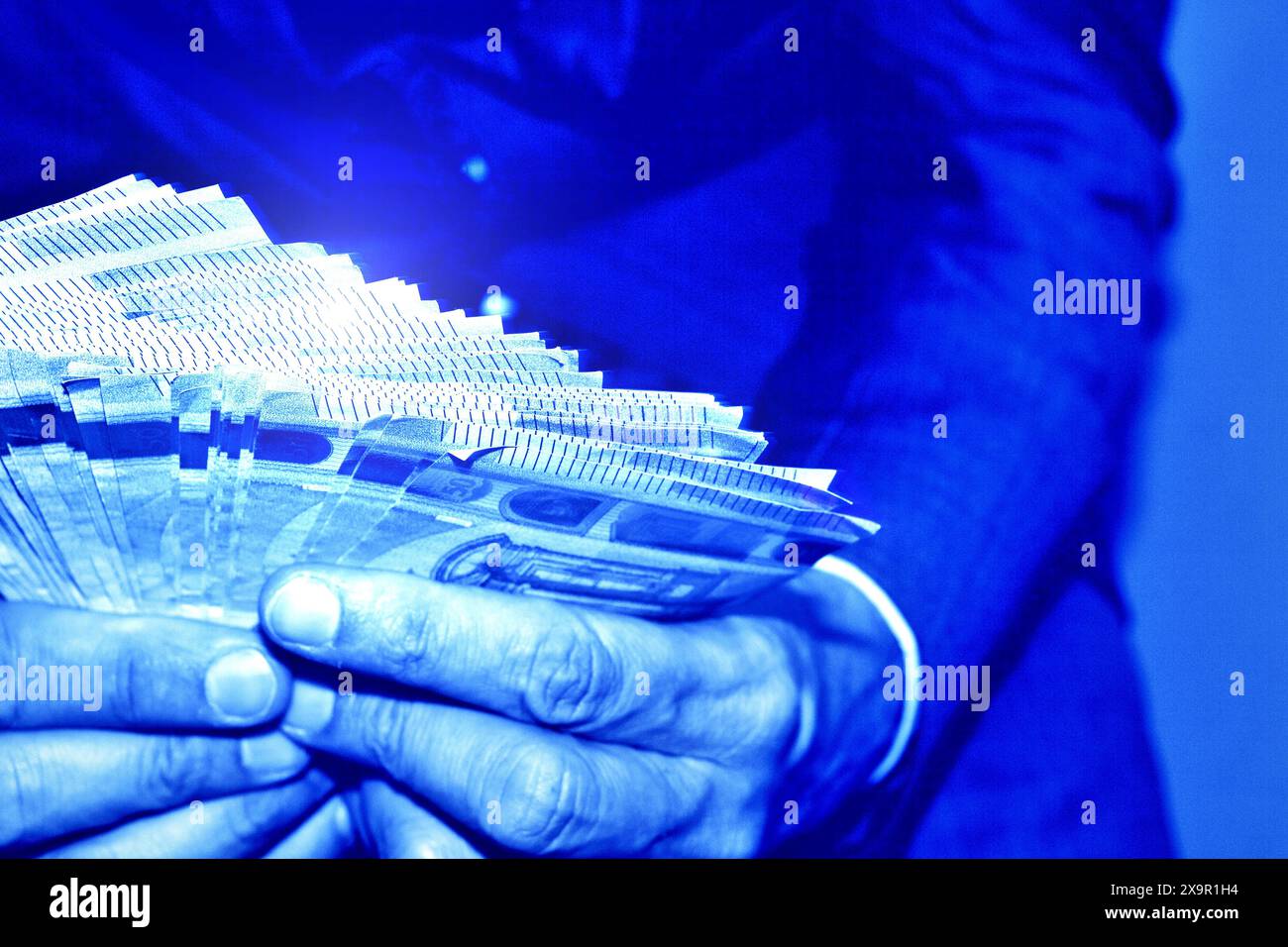Business man holding euro banknotes on his hand Stock Photo - Alamy