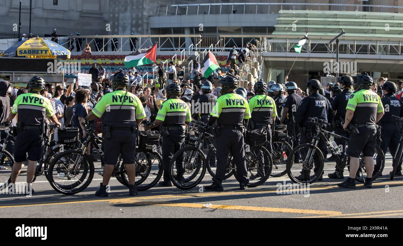 Brooklyn, NY - May 31 2024: NYPD officers with bicycles and helmets ...