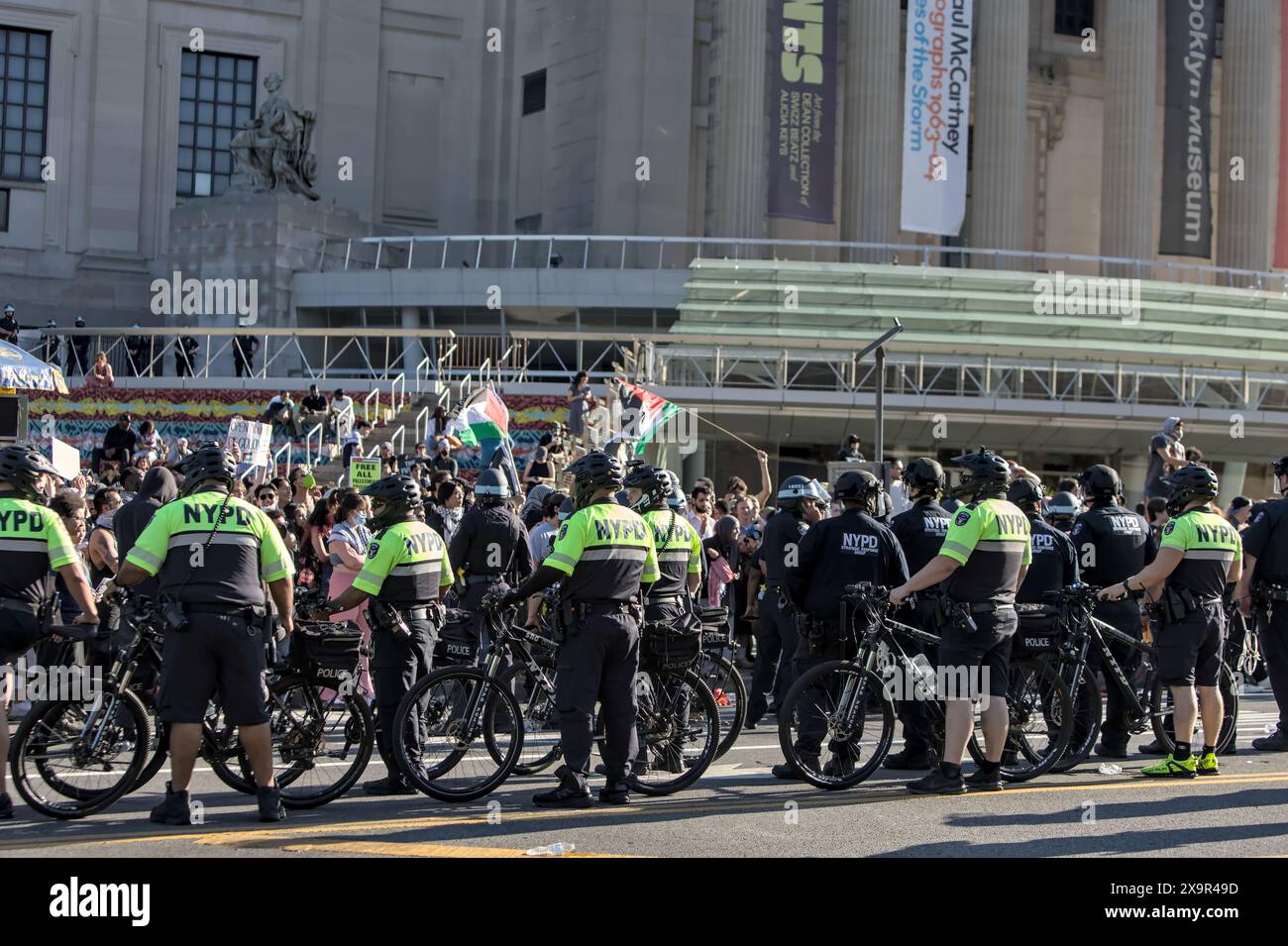 Brooklyn, NY - May 31 2024: NYPD officers with bicycles and helmets ...