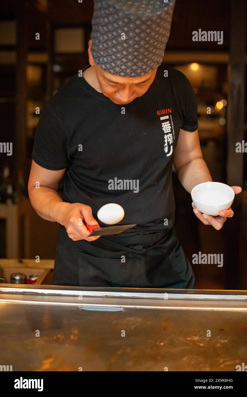 Berlin, Germany 08. 16. 2023. Teppanyaki chef cooking at teppan in a ...