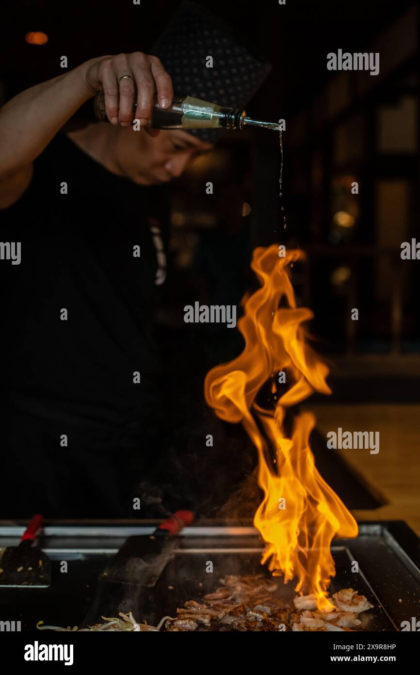 Berlin, Germany 08. 16. 2023. Teppanyaki chef cooking at teppan in a ...