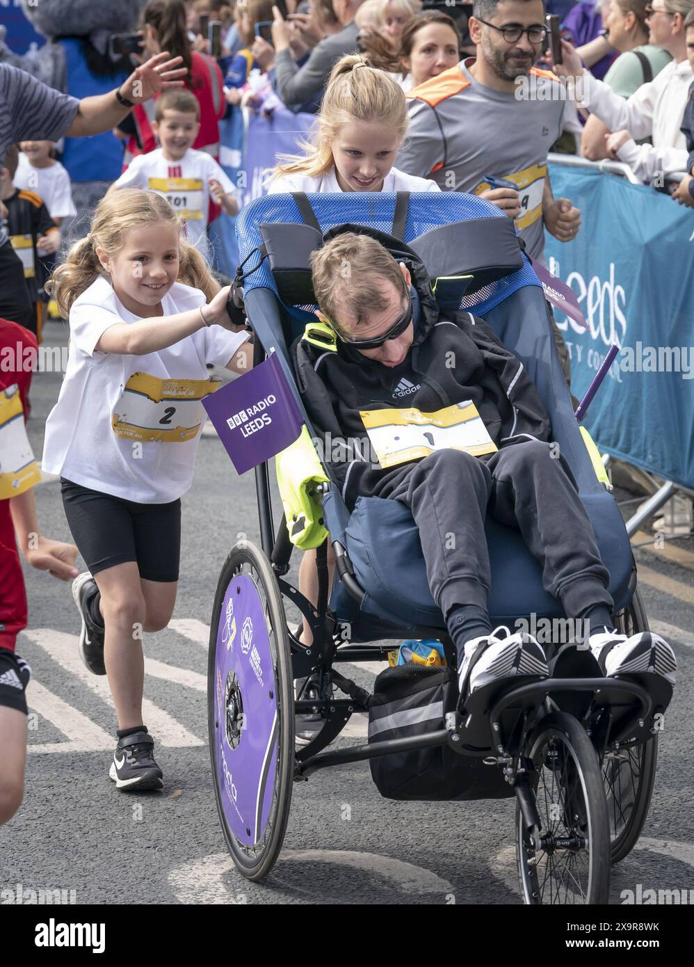 File photo dated 18/06/23 of Rob Burrow pushed by his daughters, Maya ...