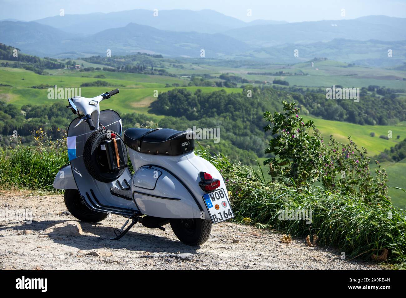 A traditional vespa parked at a viewpoint overlooking traditional ...