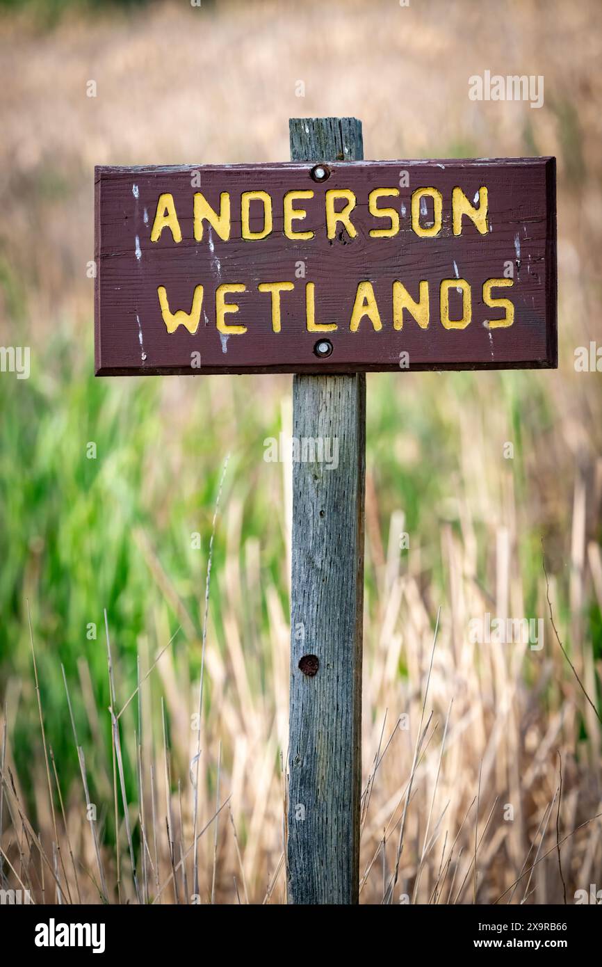 Wood sign in nature with an areas name Stock Photo - Alamy