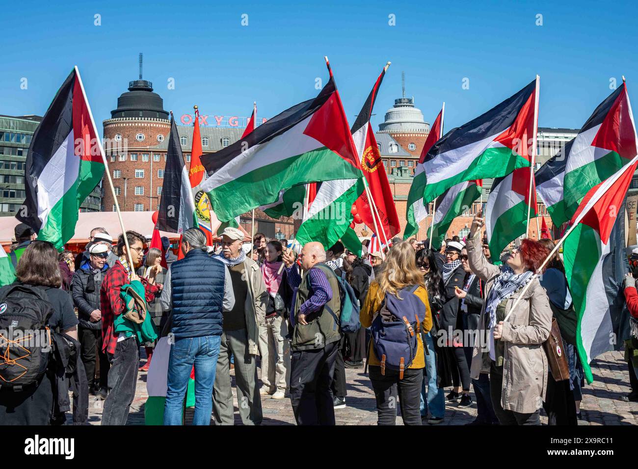 People with Palestinian flags before Labor Day march on Hakaniemi ...
