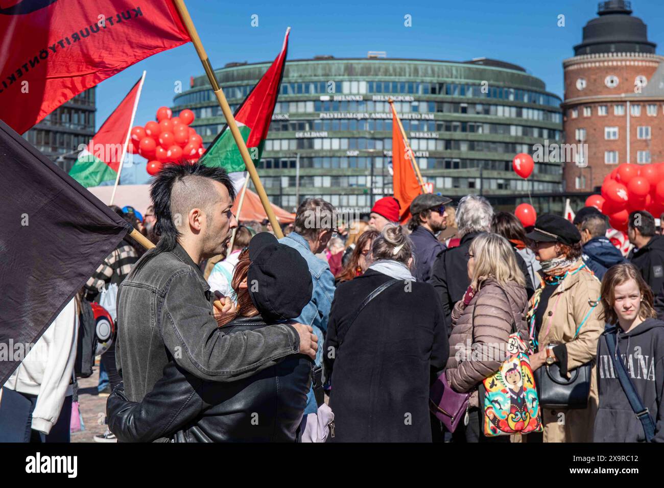 People with flags gathered at Hakaniemi Market Square before Labor Day ...