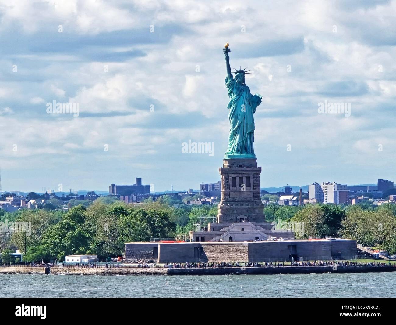 View of the Statue of Liberty lighthouse and Liberty Island from the ...